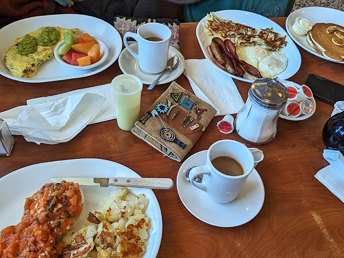 Breakfast spread that would make your grandmother proud—colorful omelets, crispy hash browns, and pancakes that deserve their own ZIP code, all washed down with bottomless coffee.