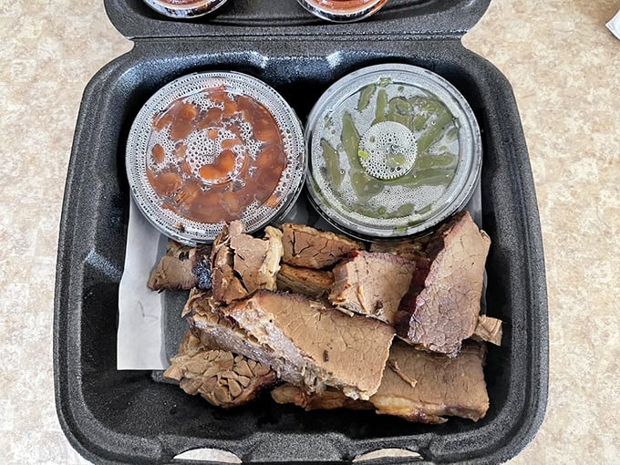 Brisket that's been kissed by smoke and time, with sides of beans and greens. This isn't just dinner—it's edible evidence that patience is indeed a virtue.