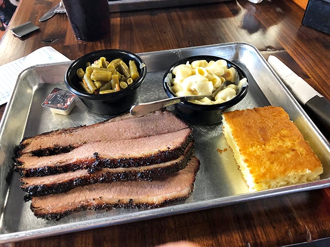 Brisket with that perfect pink smoke ring isn't just meat—it's a time capsule of patience. Those sides aren't playing supporting roles; they're co-stars.