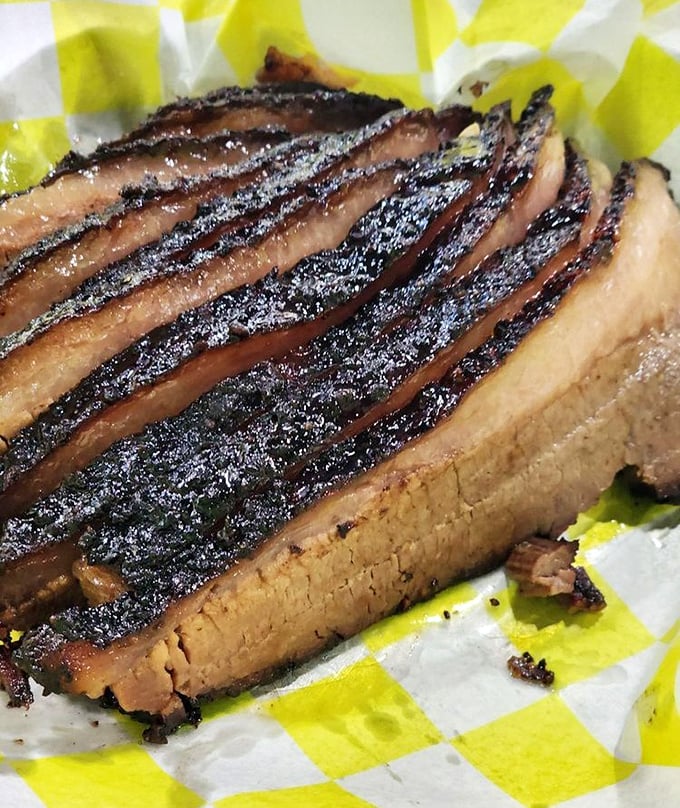 Behold the holy grail of barbecue—brisket with that perfect smoke ring and bark that makes time stand still. Poetry doesn't get more beautiful than this.