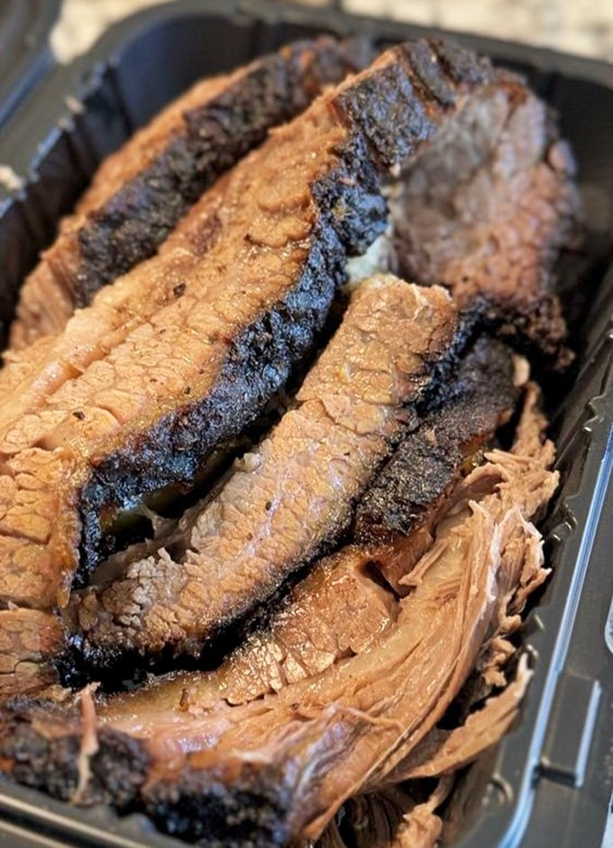 Behold the brisket in all its glory—that bark, that smoke ring! This isn't just meat; it's a 14-hour labor of love.