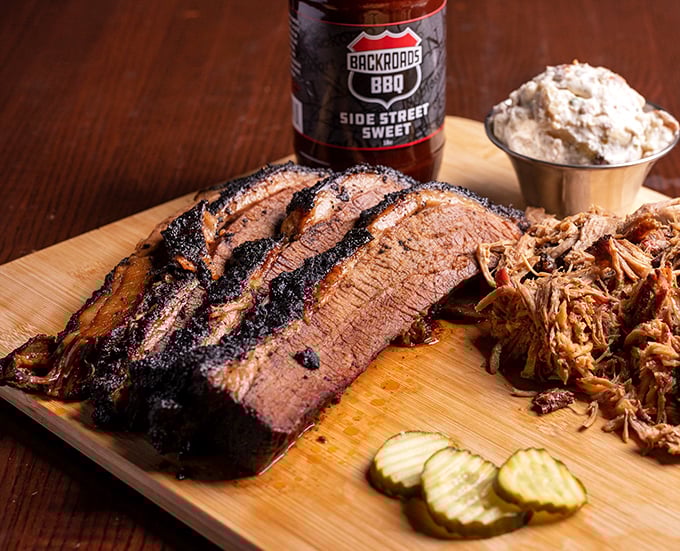 Brisket with that perfect pink smoke ring and bark that would make a Texan weep with joy. Meat candy at its finest!