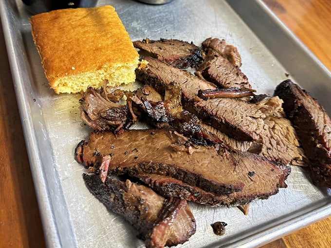Brisket so tender it practically surrenders to your fork, with cornbread standing by for sauce-sopping duty.