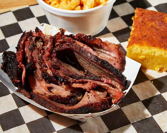 Behold the brisket in all its glory—that smoke ring isn't just for show, it's a pink badge of honor earned through hours of patient smoking.