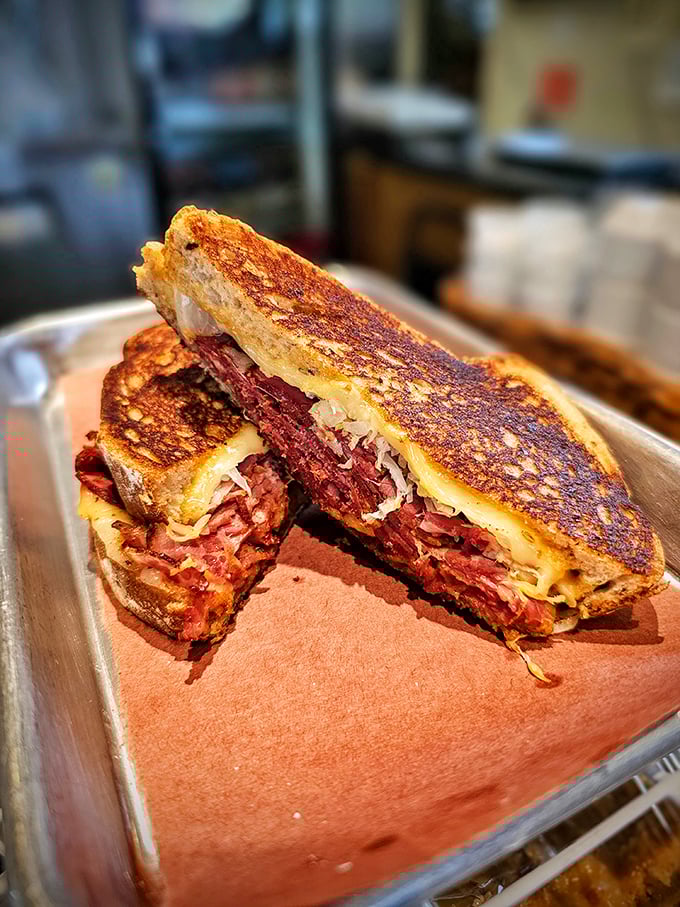 Behold the brisket grilled cheese in all its glory – crispy bread embracing tender smoked meat and melted cheese perfection.