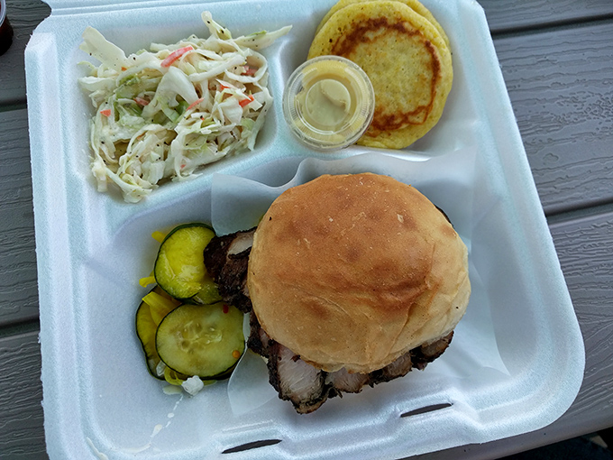 This isn't just a sandwich—it's architecture. Perfectly stacked brisket with pickles, slaw, and a bun that knows its supporting role.