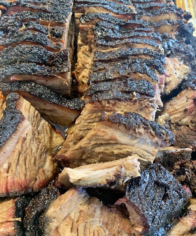 Brisket so tender it practically surrenders at the sight of your fork. That bark is the result of patience—a virtue that tastes particularly delicious when smoked.