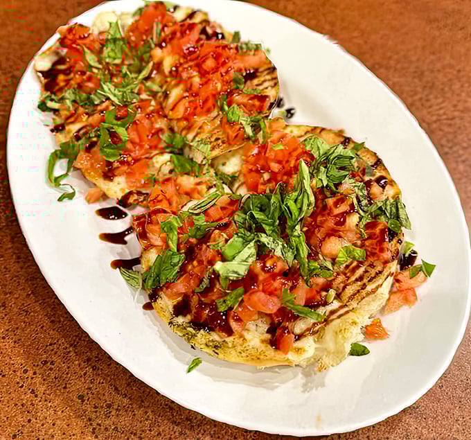 This bruschetta isn't just an appetizer—it's a masterpiece of perfectly toasted bread, vibrant tomatoes, and fresh basil that would make an Italian grandmother weep with joy.