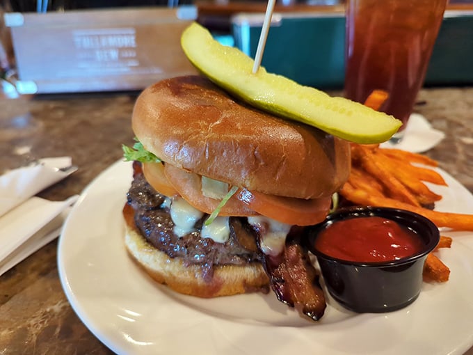 This isn't just a burger—it's a towering masterpiece of beef, melty cheese, and fresh toppings that demands both hands and several napkins.