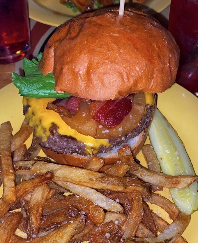 This isn't just a burger—it's an architectural marvel of beef, cheese, and toppings that makes skyscrapers jealous of its perfect proportions.