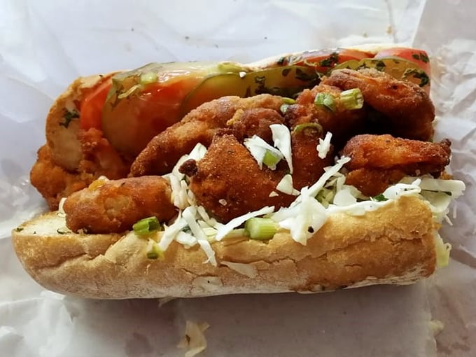 This po' boy isn't just a sandwich; it's architectural poetry—crispy fried seafood, fresh toppings, and bread with that perfect crunch-to-softness ratio that haunts your dreams.