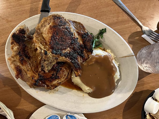 These Cajun pork chops don't just whisper spice—they sing it, accompanied by a pool of gravy that demands to be sopped up with every last bite.