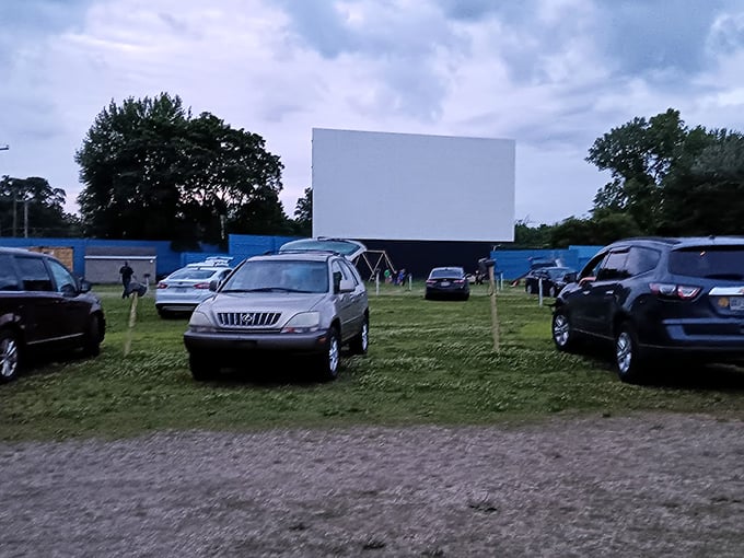 SUVs and sedans gather like modern-day covered wagons, circled around their communal campfire—a story projected 40 feet high.
