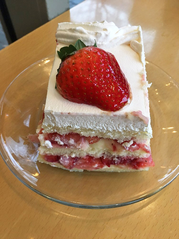 This strawberry cassata cake isn't just dessert; it's edible architecture—layers of sponge, cream, and fresh berries that would make Michelangelo weep with joy.