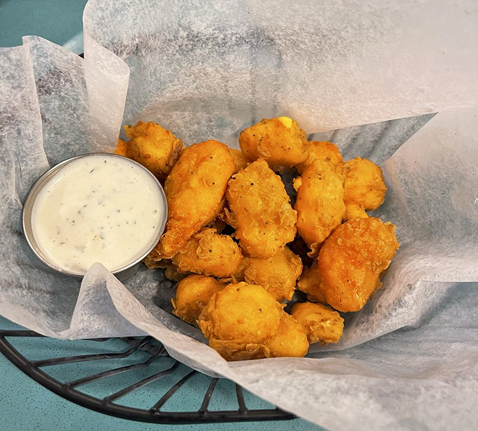 Golden orbs of Wisconsin perfection. These cheese curds achieve that mythical balance of crispy exterior and molten, stretchy interior.