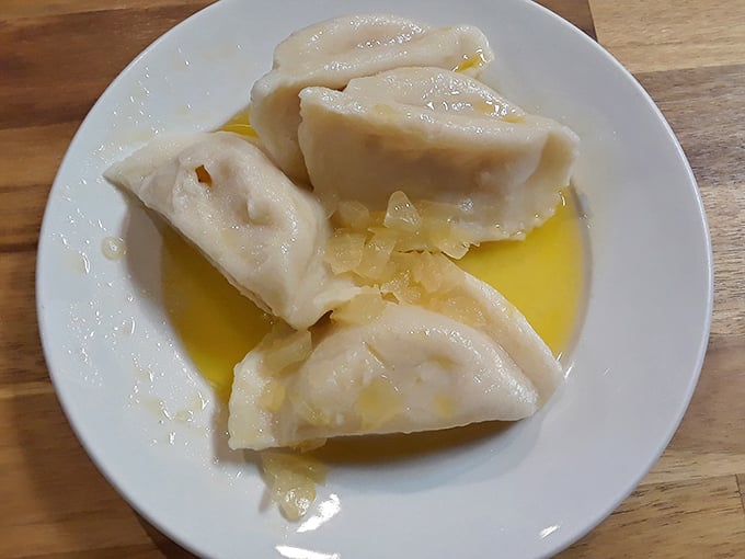 These cheese pierogies swim happily in melted butter, like little pillows of joy that whisper, "Diet plans are overrated anyway."