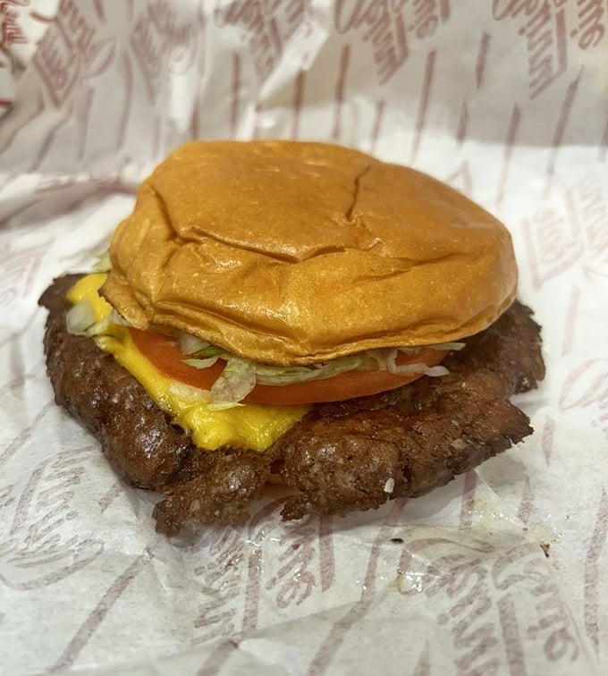 This isn't just a burger—it's edible architecture where each ingredient plays a crucial structural and flavor role.