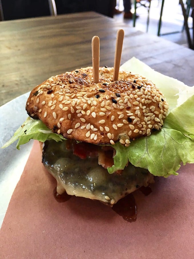 The "Best Damn Grass Fed Cheeseburger" isn't just a name – it's a sesame-studded promise delivered with melty cheese and perfect proportions.