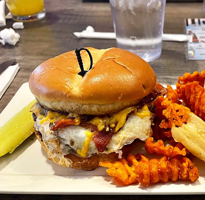 This isn't just a burger—it's edible architecture. Melted cheese cascades over bacon like delicious lava from Mount Appetite.