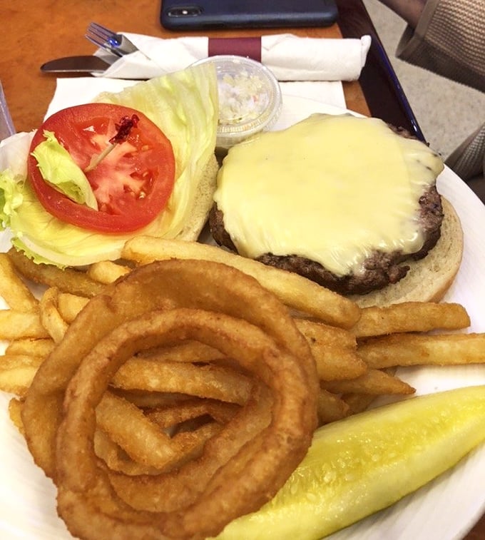 Not all cheeseburgers are created equal—this one arrives with an onion ring crown and a pickle scepter, ready to rule your lunch hour.