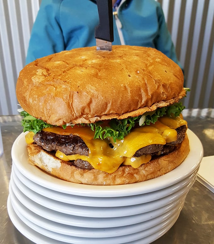 Not so much a burger as a skyscraper of beef and cheese—this masterpiece requires jaw exercises before attempting.