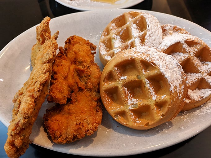 Behold the crown jewel: chicken and waffles that achieve that impossible balance of crispy, savory, sweet, and indulgent—a plate that could unite warring nations.