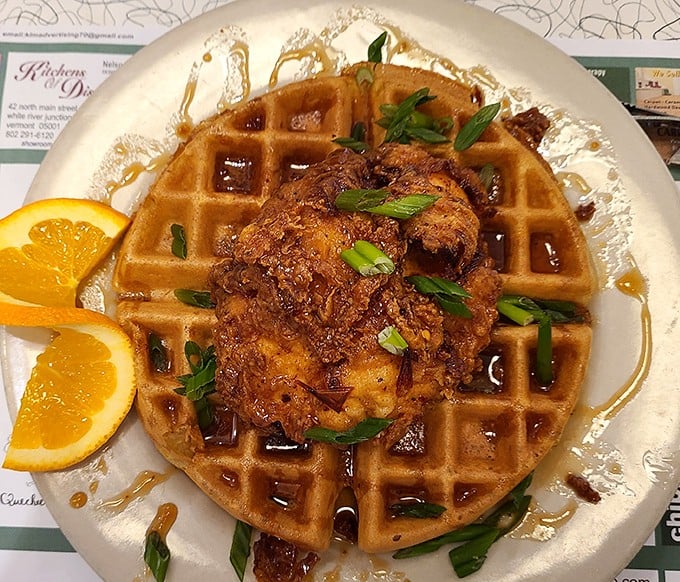 Behold the star attraction: chicken and waffles that would make your Southern grandmother weep with pride. That golden waffle isn't just a platform—it's a throne.