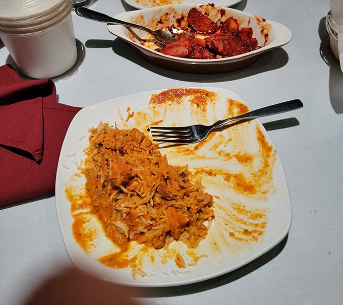 Behold the infamous chicken biryani—evidence that rice can indeed change your life. Those orange-stained edges tell tales of spices that traveled continents.