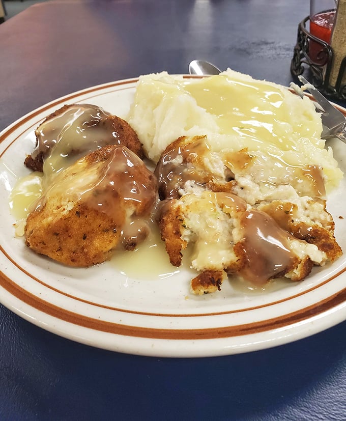 The legendary chicken croquettes arrive swimming in gravy that should have its own zip code. This isn't just comfort food—it's a warm hug on a plate.