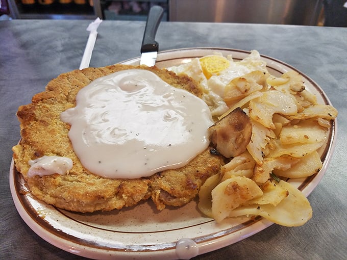 The holy grail of heartland cuisine – golden-crusted chicken fried steak swimming in peppery gravy. This isn't just dinner; it's edible therapy after a long day.