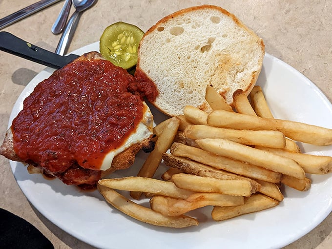 Behold the star attraction—a chicken parmesan sandwich that makes other sandwiches question their life choices. That sauce-to-cheese ratio is nothing short of poetry.