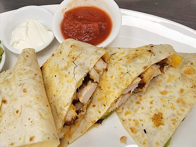 This quesadilla isn't playing games—packed with tender chicken and melty cheese, it's the comfort food equivalent of a warm hug from your favorite aunt.