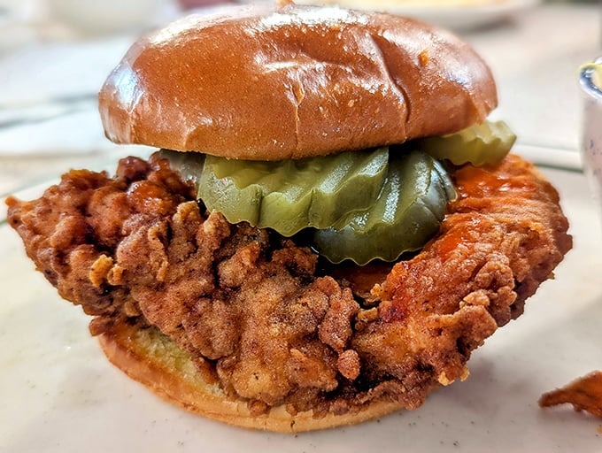 The chicken sandwich that launched a thousand cravings. That pickle isn't just garnish—it's the perfect acidic counterpoint to the crispy, golden-brown perfection beneath it.