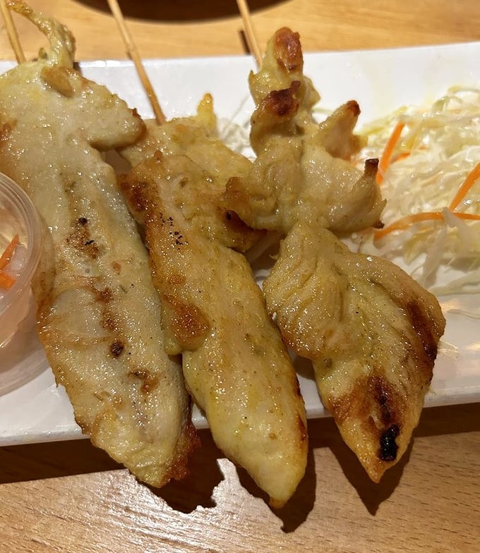 Chicken satay that would make Bangkok street vendors nod in approval. Those grill marks aren't just decoration—they're flavor tattoos.
