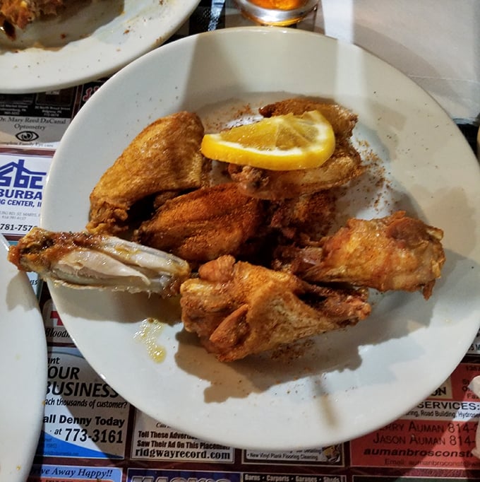 Golden-fried wings with a lemon garnish—because sometimes the simplest pleasures are the ones that make you close your eyes and sigh.