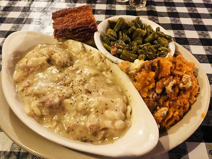 Behold the legendary chicken and dumplings – a creamy, soul-warming masterpiece that's converted more non-believers than a Sunday revival.