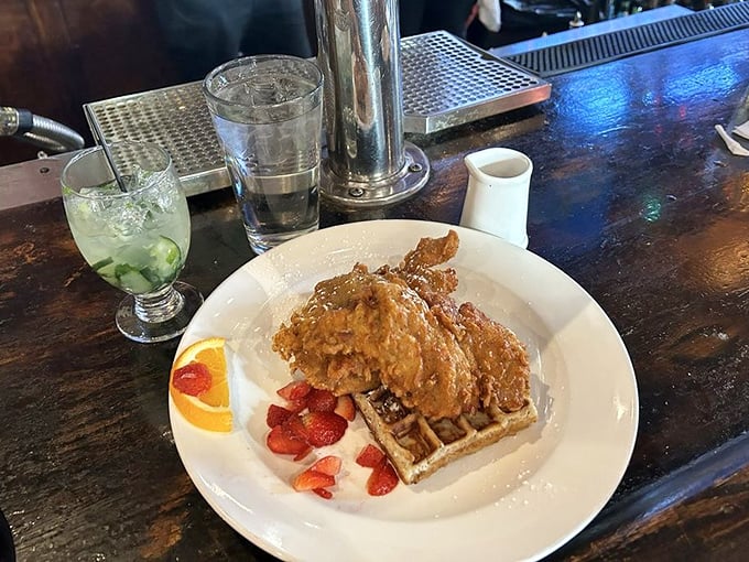 The holy grail of comfort food! Golden-fried chicken perched atop a fluffy waffle with fresh berries – a breakfast-dinner mashup worthy of worship.