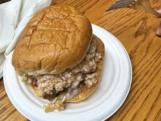 The chopped BBQ sandwich—a perfect marriage of soft bun and smoky pork that makes you wonder why humans ever bothered inventing complicated food.