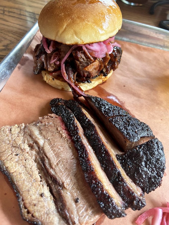 Behold the holy grail of Texas barbecue: brisket with a bark so perfect it should be in a museum. That smoke ring is basically nature's way of applauding.
