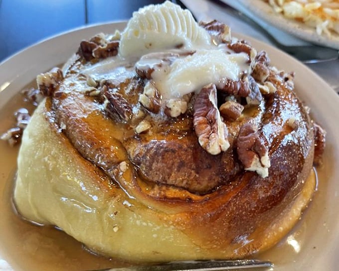 This isn't just a cinnamon roll—it's a spiritual experience with butter, pecans, and enough gooey goodness to make you weep with joy.
