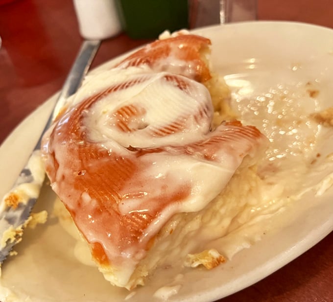 Behold the holy grail of breakfast pastries—a cinnamon roll so perfectly iced it makes you question every other cinnamon roll relationship you've ever had.