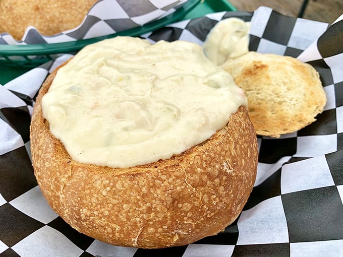 Clam chowder served in a sourdough bread bowl – nature's perfect dishware meets the Pacific Ocean's creamiest creation. Spoons up, phones down.