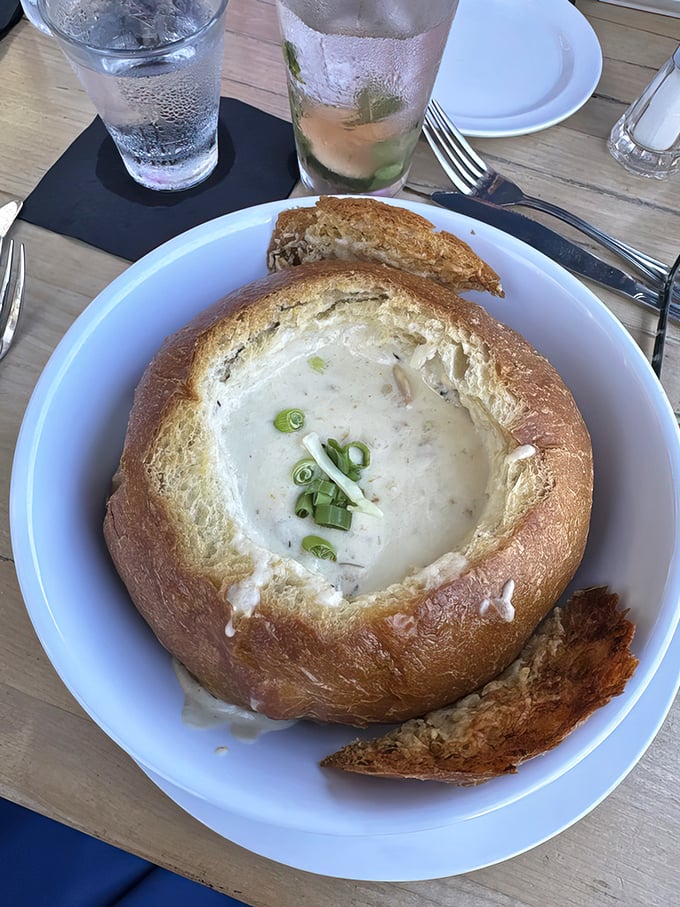 Not just any clam chowder – this sourdough bread bowl cradles creamy perfection topped with green onions, like a warm hug from the sea itself.