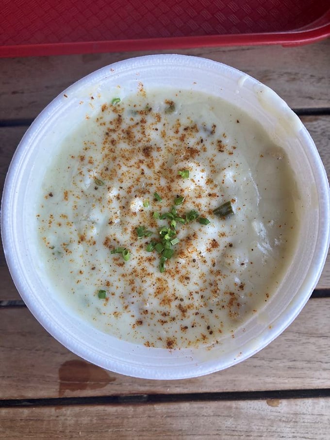 Behold the legendary clam chowder in all its creamy glory. Those flecks of herbs and spice aren't just garnish – they're little flavor messengers from Neptune himself.