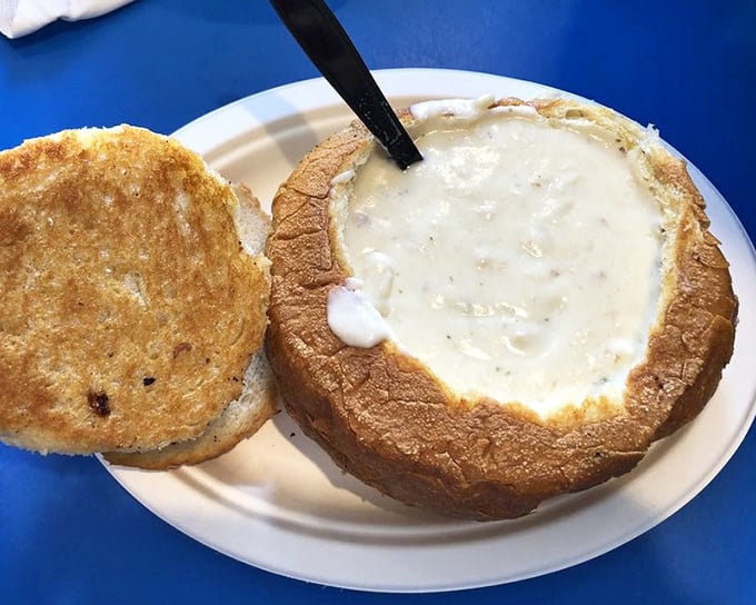 Behold the crown jewel: clam chowder served in a hollowed sourdough bread bowl. It's not just soup—it's an edible masterpiece that's worth every mile of the drive.