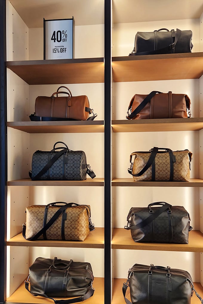 Designer duffle bags displayed like fine art, except these masterpieces won't require taking out a small business loan.