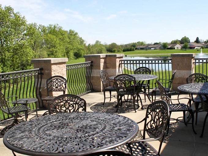 Wrought iron elegance meets panoramic pond views. The perfect spot for morning coffee or evening contemplation – no reservation required.