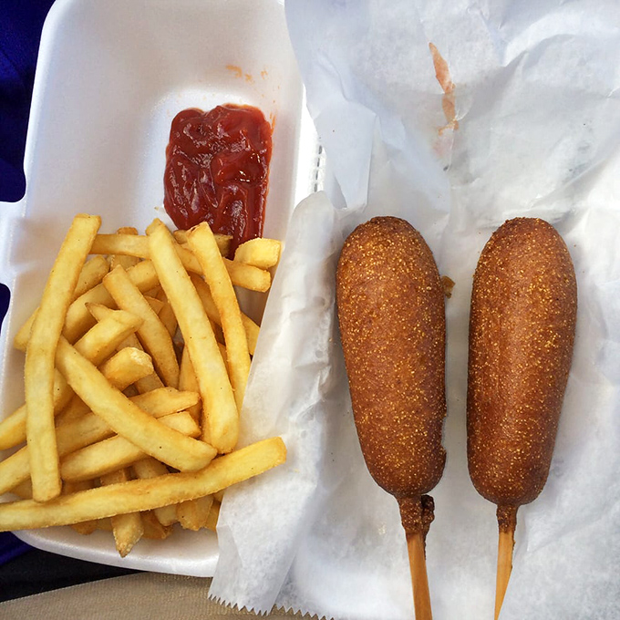 Two golden corn dogs paired with crispy fries – this is the kind of simple perfection that makes you wonder why anyone complicates food.