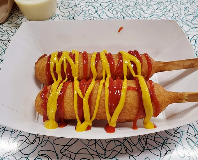 Golden-battered perfection on a stick. Add mustard and ketchup for the full experience, or enjoy them naked in their cornmeal glory.