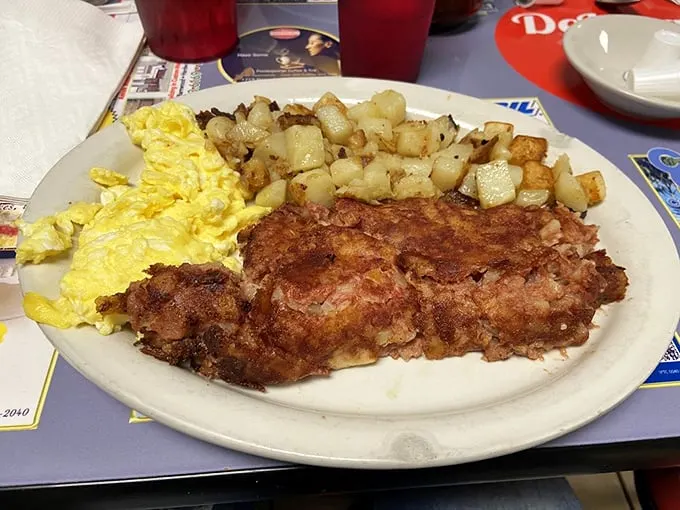 Behold the legendary corned beef hash—crispy-edged, tender-centered, and paired with eggs that could make a rooster proud.